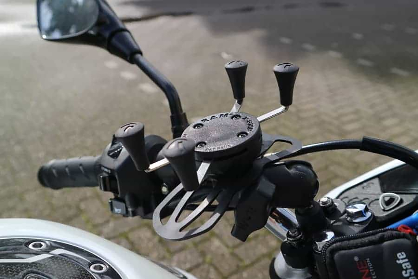 Motorcycle Cell Phone Mount Battle: Quad Lock vs. RAM